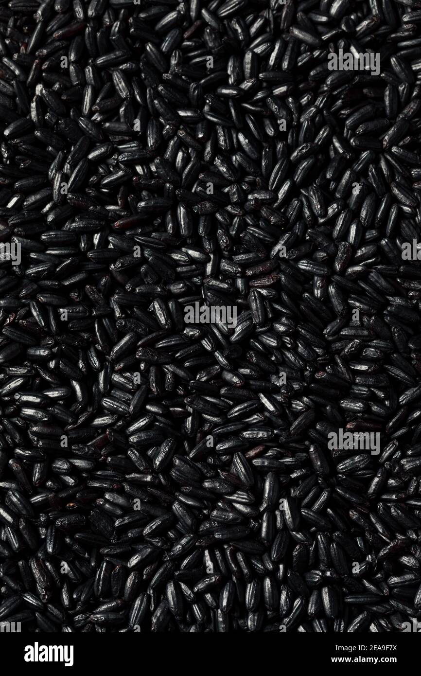 Dry Organic Asian Black Rice in a Bowl Stock Photo - Alamy