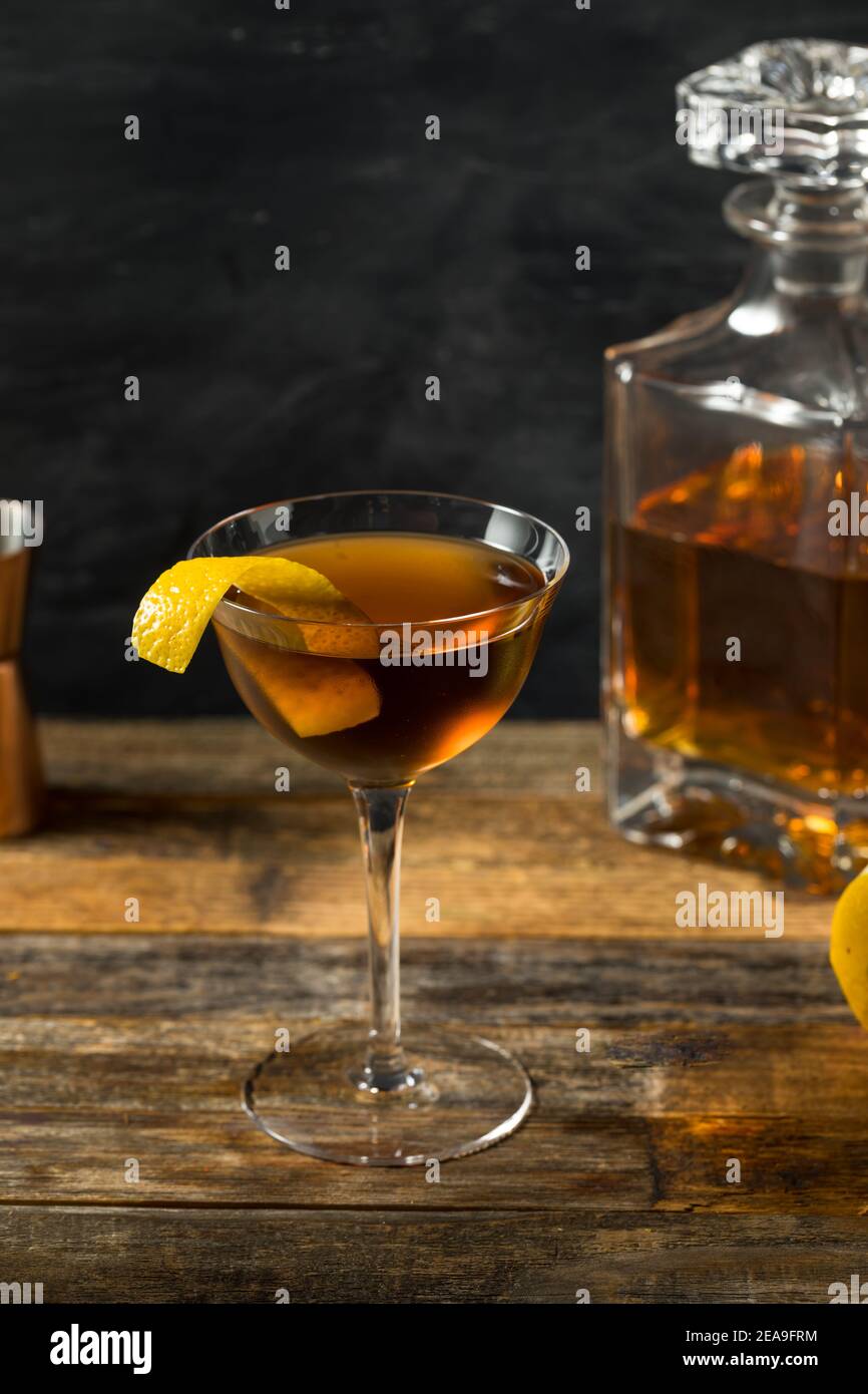 Boozy Alcoholic Scotch Bobby Burns Cocktail with a Lemon Peel Stock ...