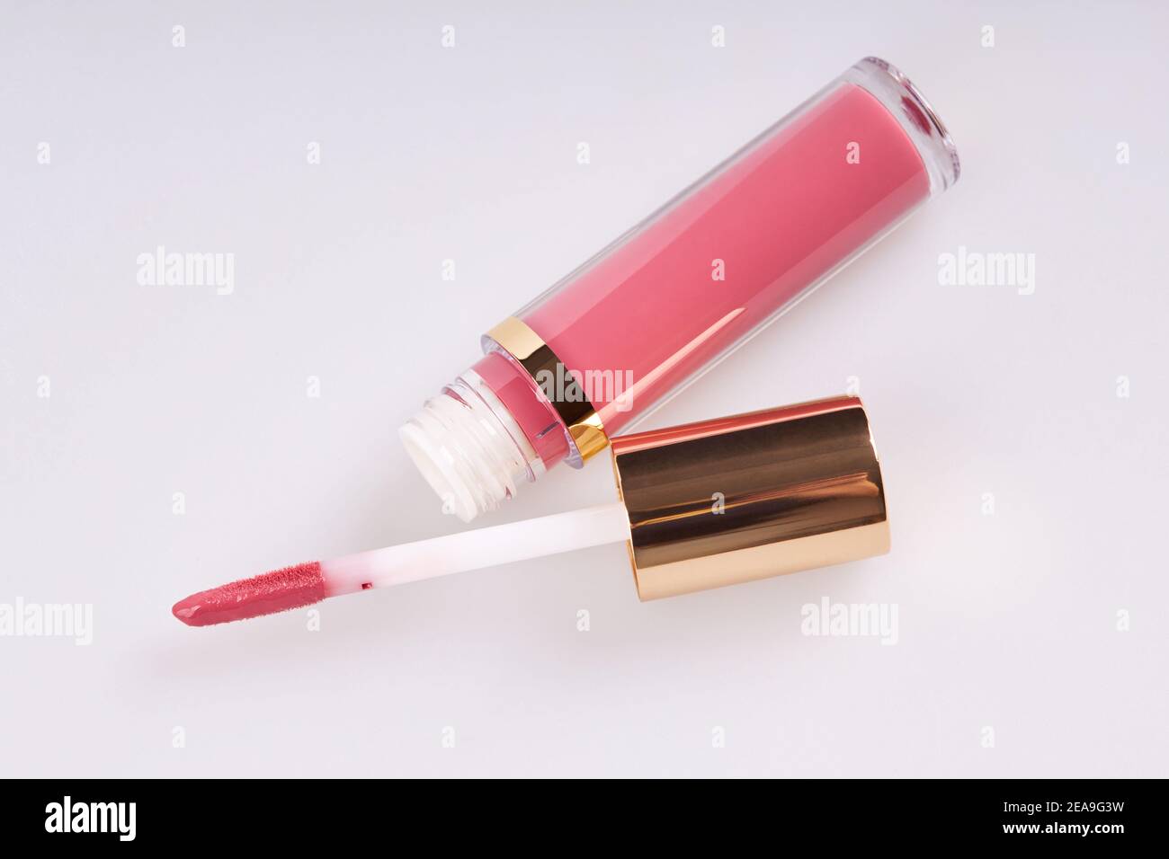 Tube of liquid lipstick gloss with applicator isolated on white ...