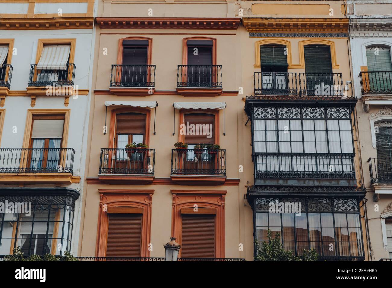 Traditional buildings on a street in Seville, Spain Stock Photo - Alamy