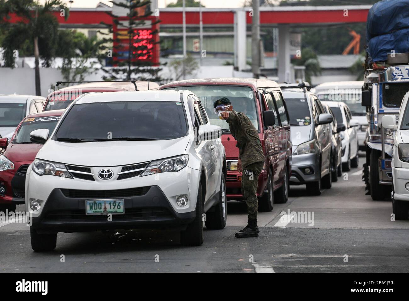 Filipino soldiers controling traffic after being deployed as part of ...