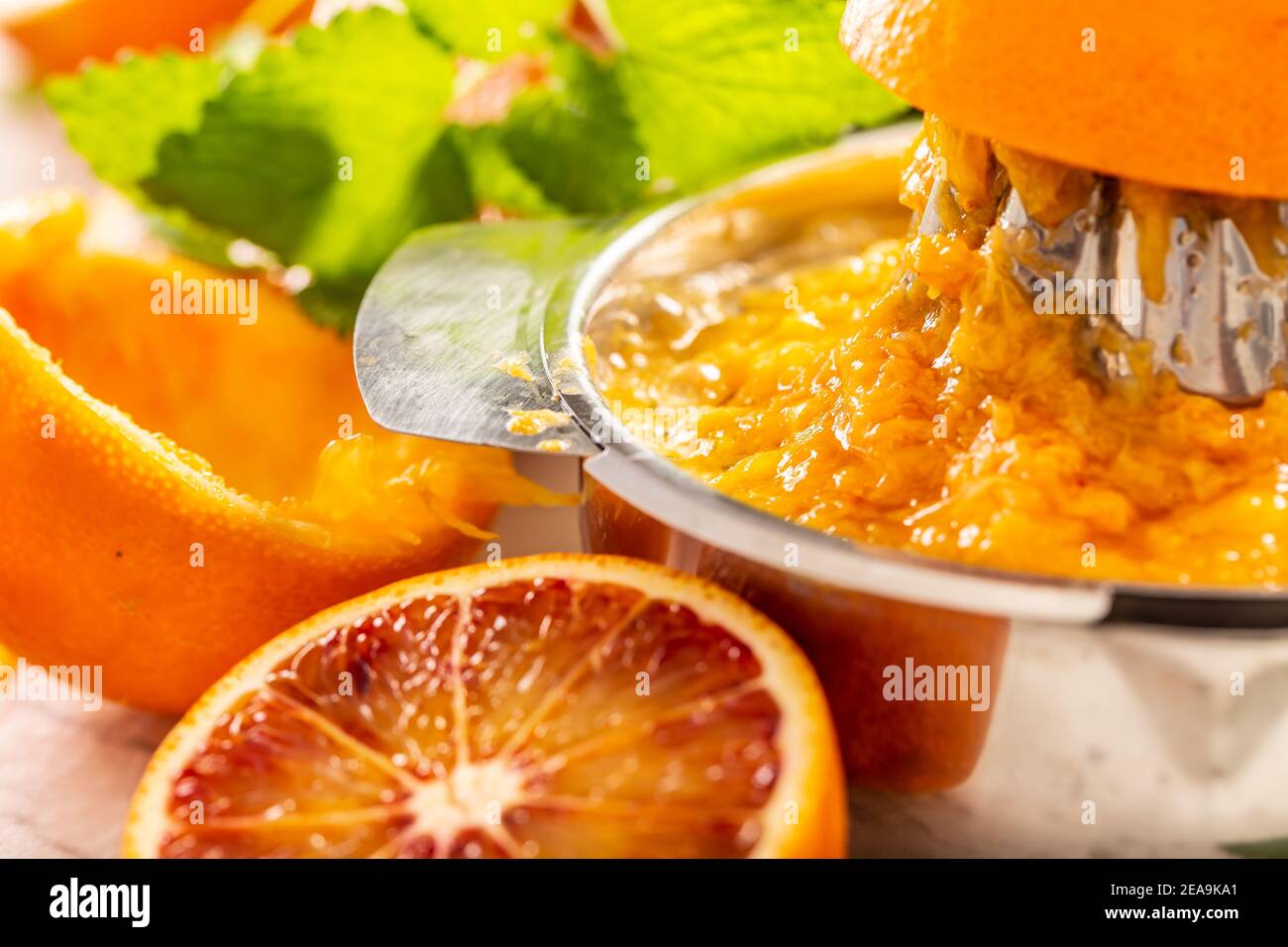 Staniless steel juicer full of orange pulp - close up Stock Photo - Alamy