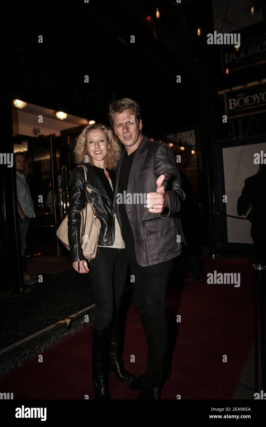 Andrew Castle posing for photos on the red carpet before attending the ...