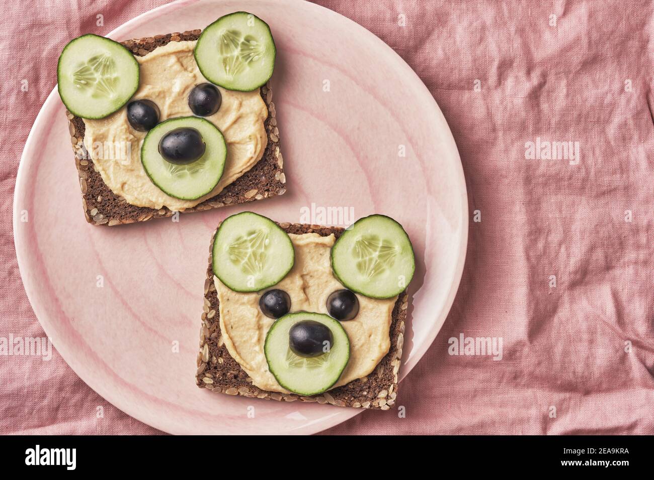 Funny bear toast with cucumber and hummus toasts Stock Photo - Alamy