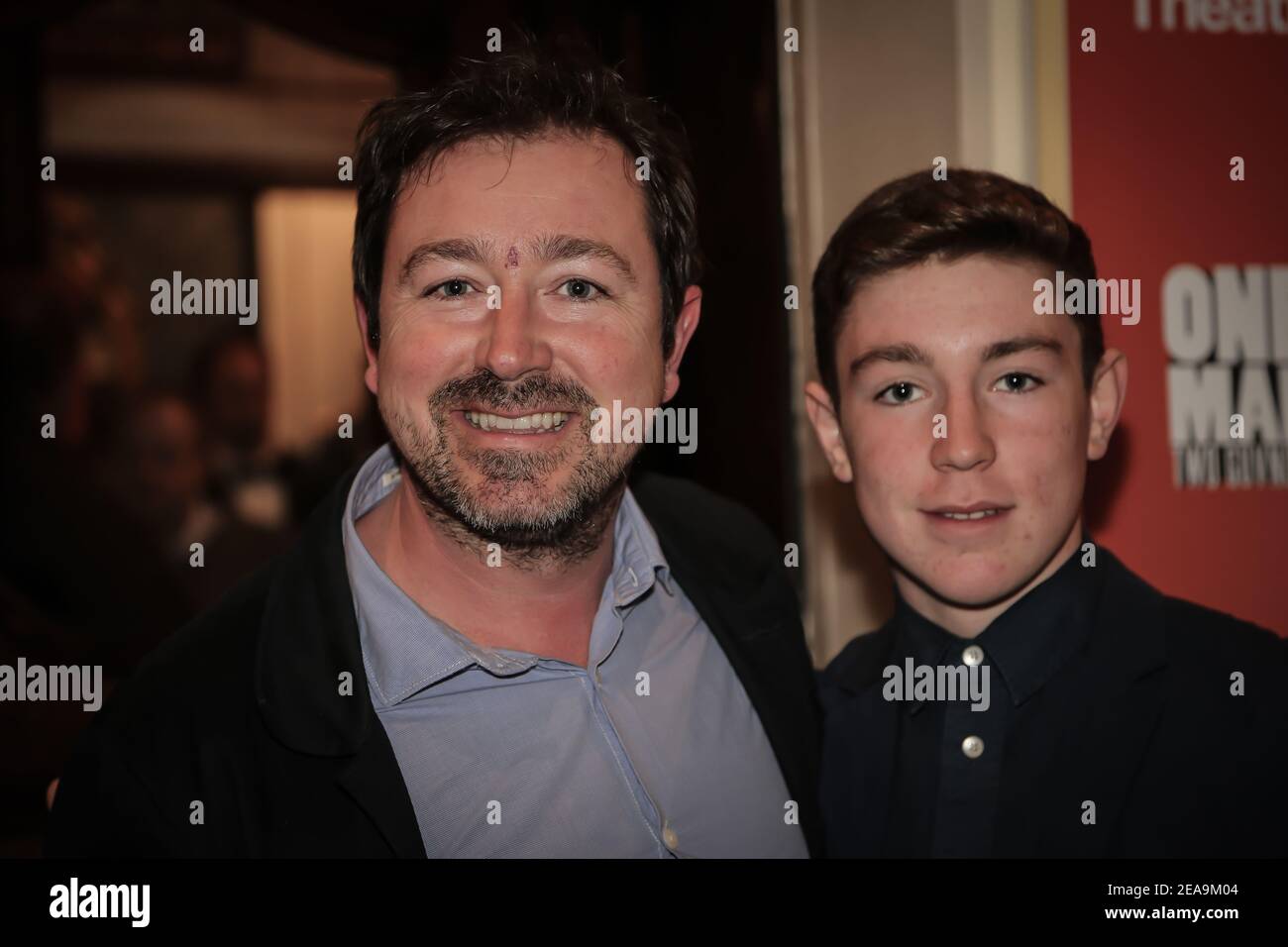Dan Ryan posing for photos on the red carpet before attending the One ...
