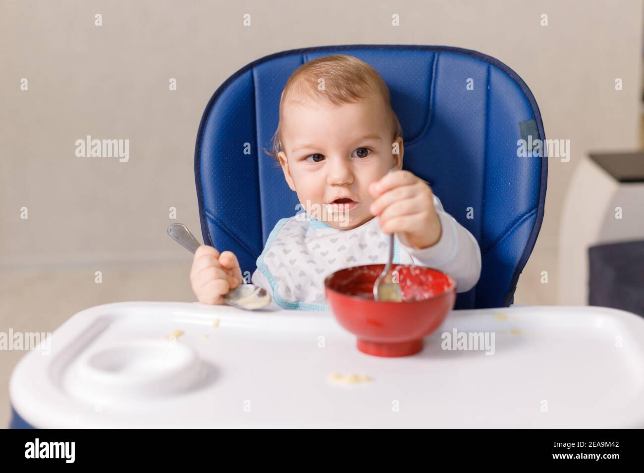 The grimy infant or toddler tries to eat independently. Baby-led ...