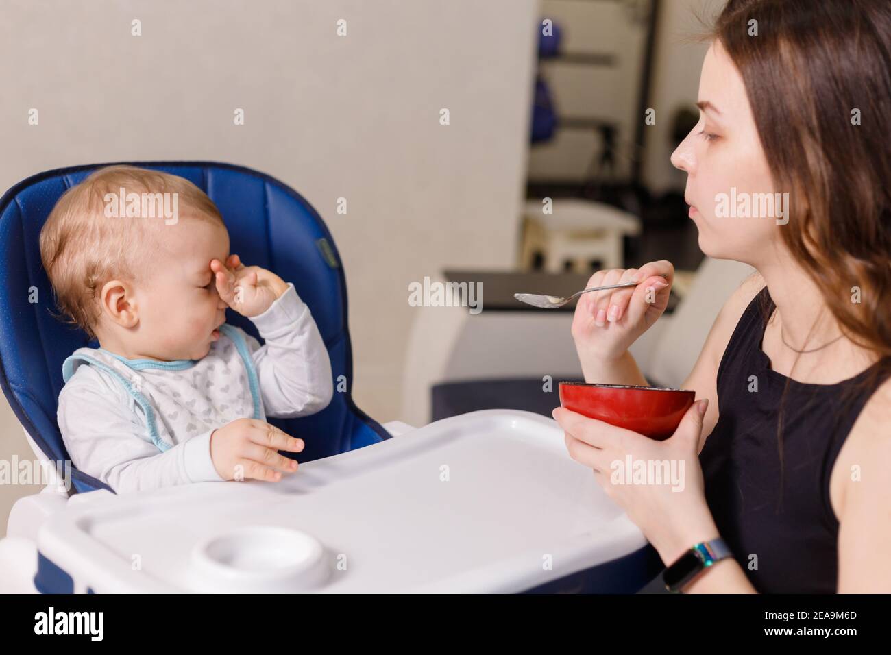 Naughty caucasian infant kid is fussy and refuses to eat Stock Photo ...