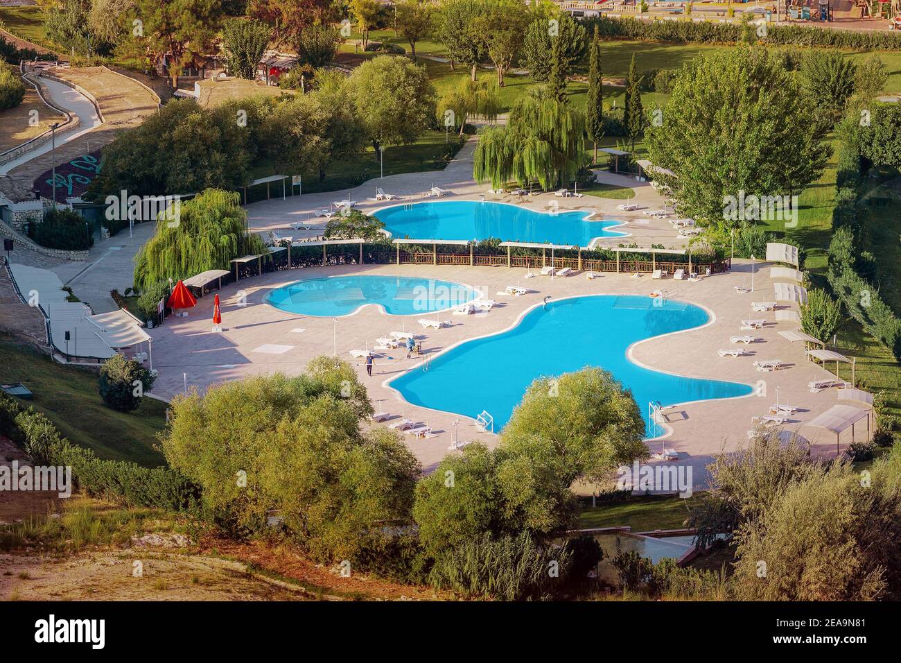 Aerial view of a public swimming pool without visitors. The pool is ...