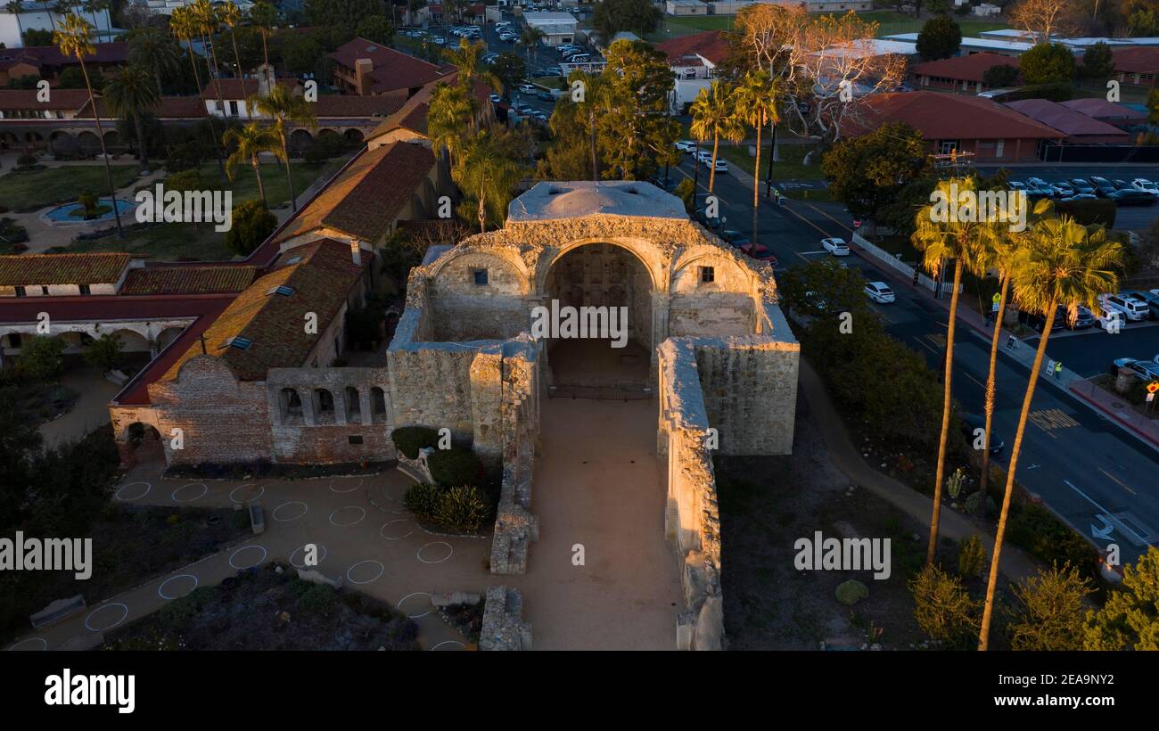 Sunset aerial view of the Spanish Colonial era mission and surrounding ...