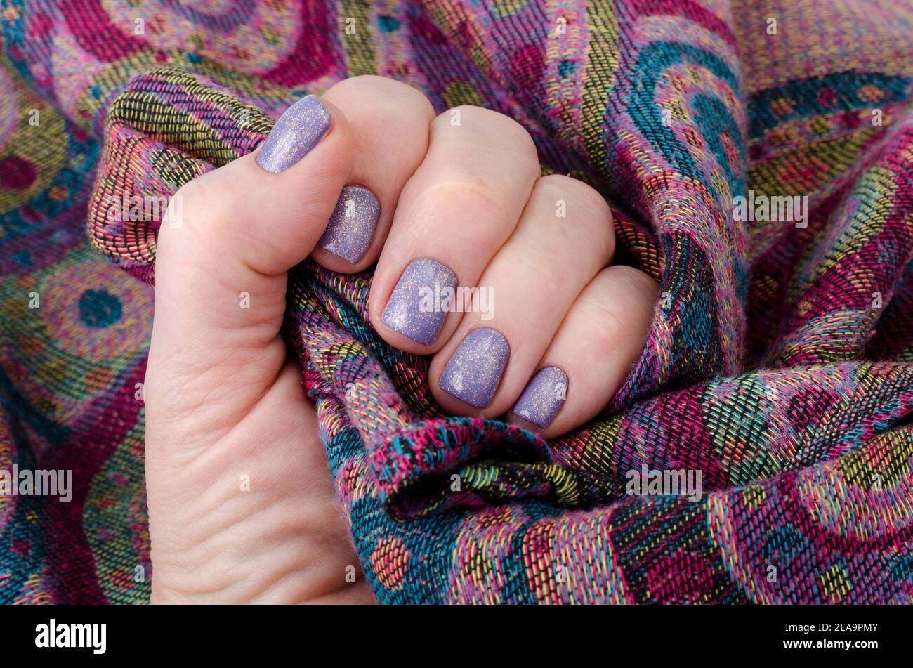 Hand of an adult woman with painted nails, manicure, nail polish ...