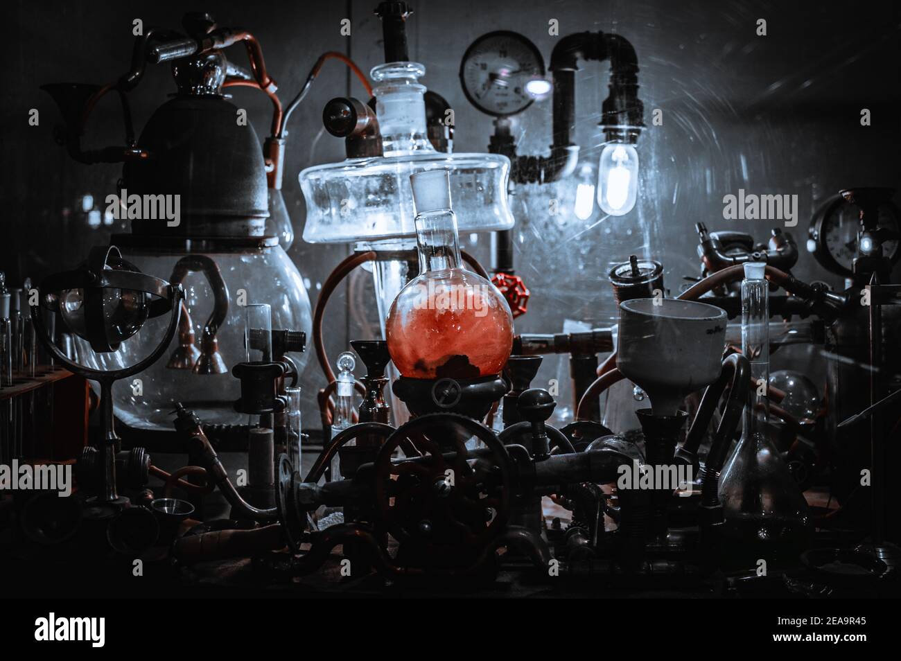 Ancient chemistry worktable and a red liquid in the flask Stock Photo ...