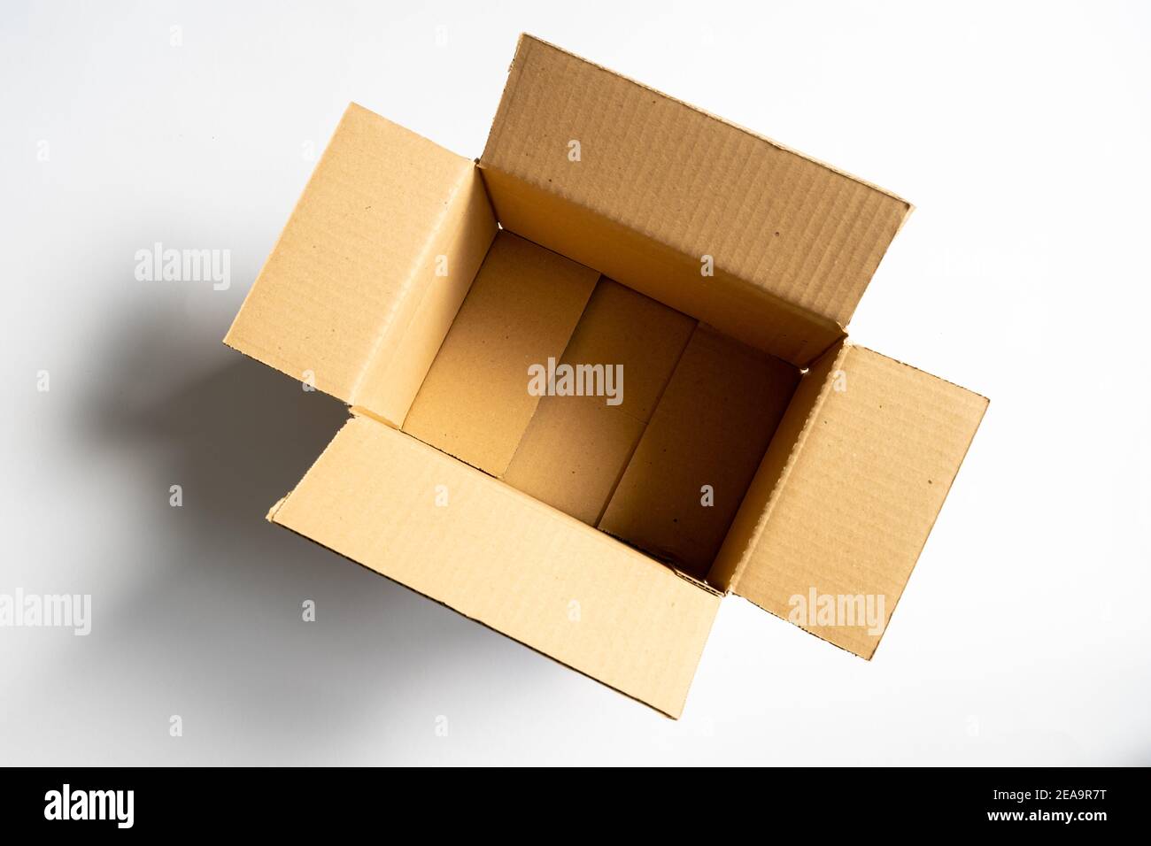 Cardboard shipping box in front of a white background. Perfect for ...