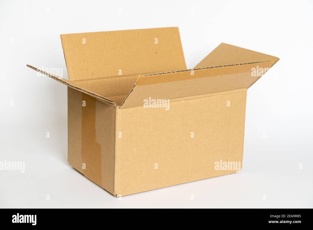 Cardboard shipping box in front of a white background. Perfect for ...