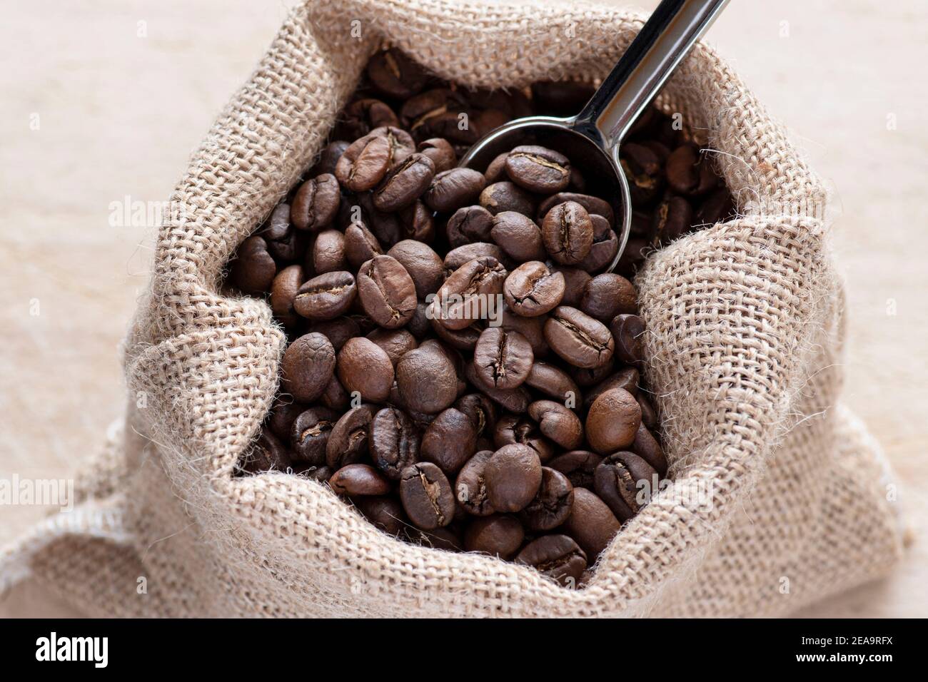 Coffee beans in a rustic jute bag Stock Photo - Alamy