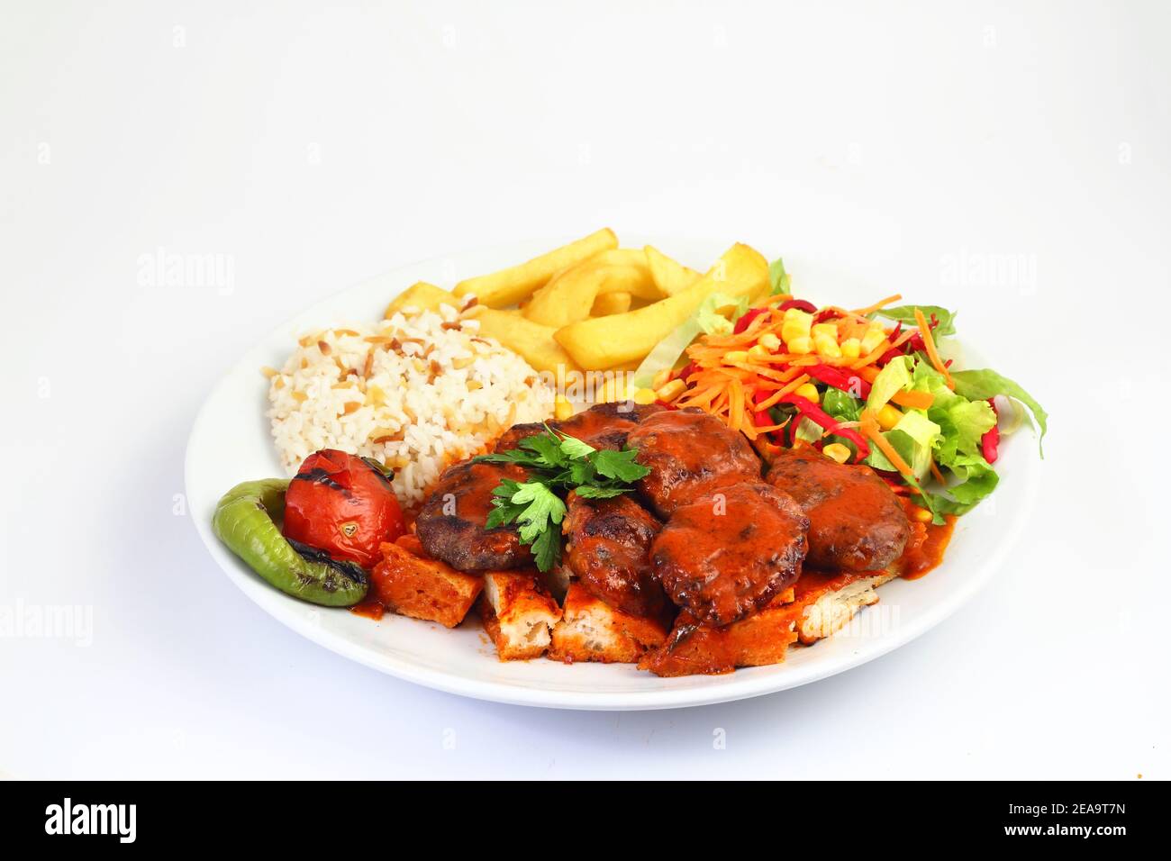 Plate of traditional grilled meatballs on white background Stock Photo ...