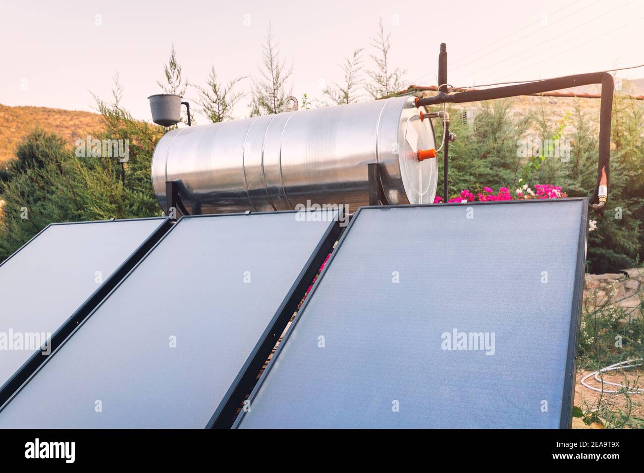 Solar panels for heating water in a barrel with rainwater collection in ...