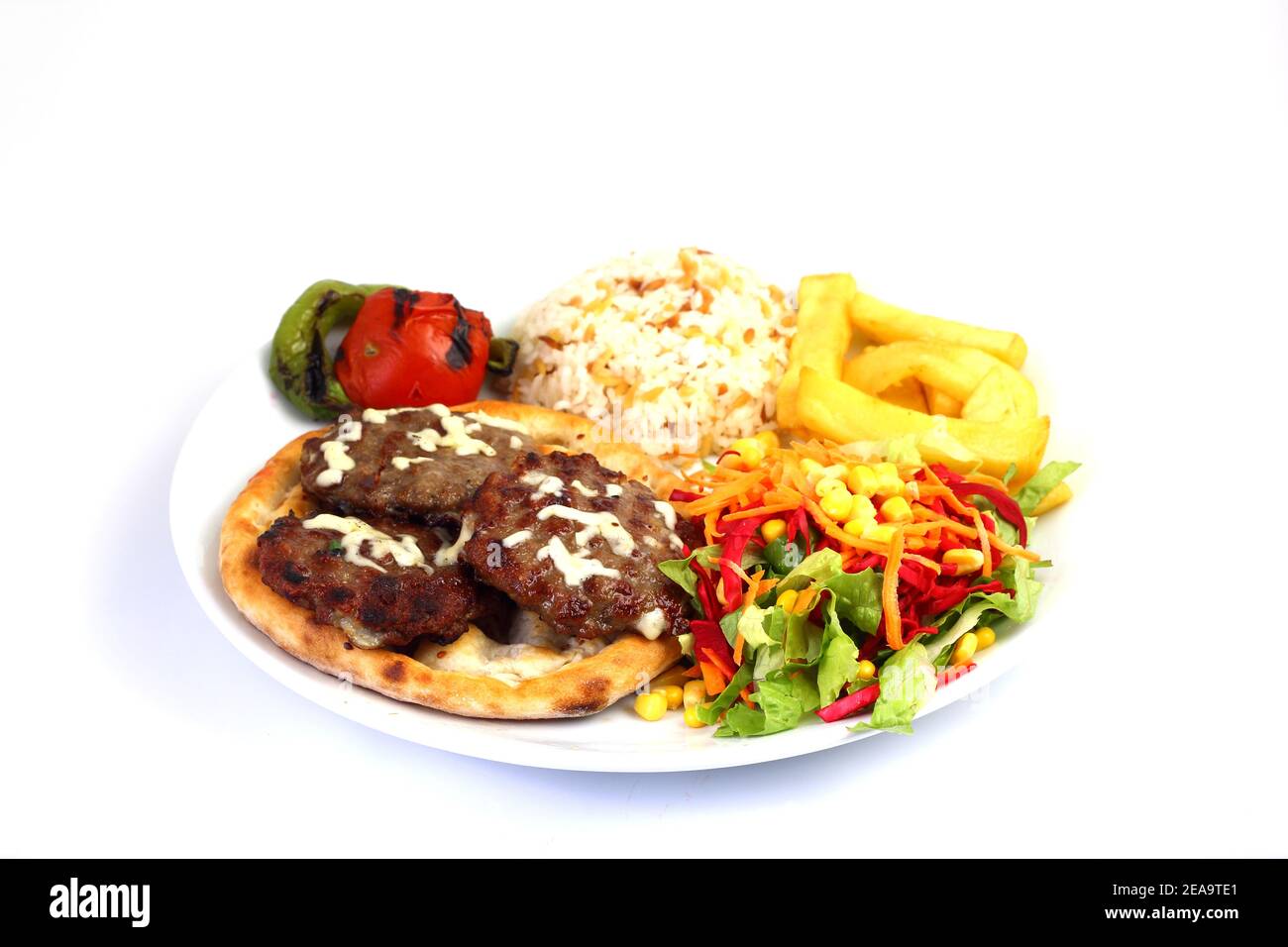 Plate of traditional grilled meatballs on white background Stock Photo ...
