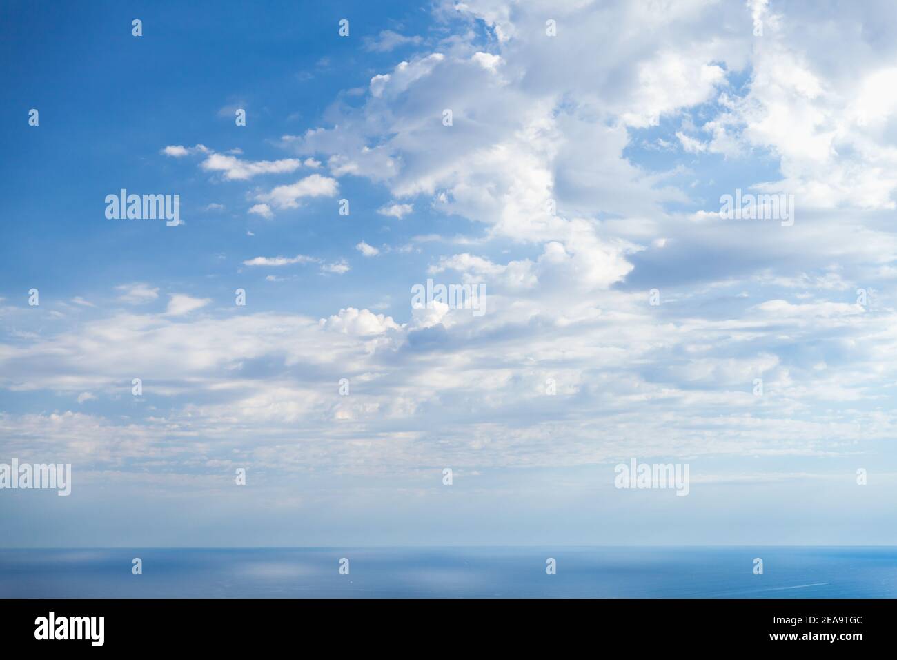 Empty coastal landscape with calm blue sea water under dramatic cloudy ...