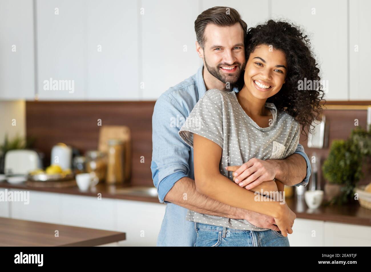 Wife hugging husband from behind hi-res stock photography and images ...