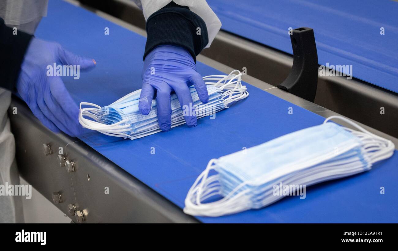 Illustration picture shows worker with masks taken in marge of a visit ...