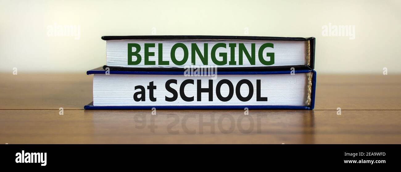 Belonging at school symbol. Books with words 'Belonging at school' on ...