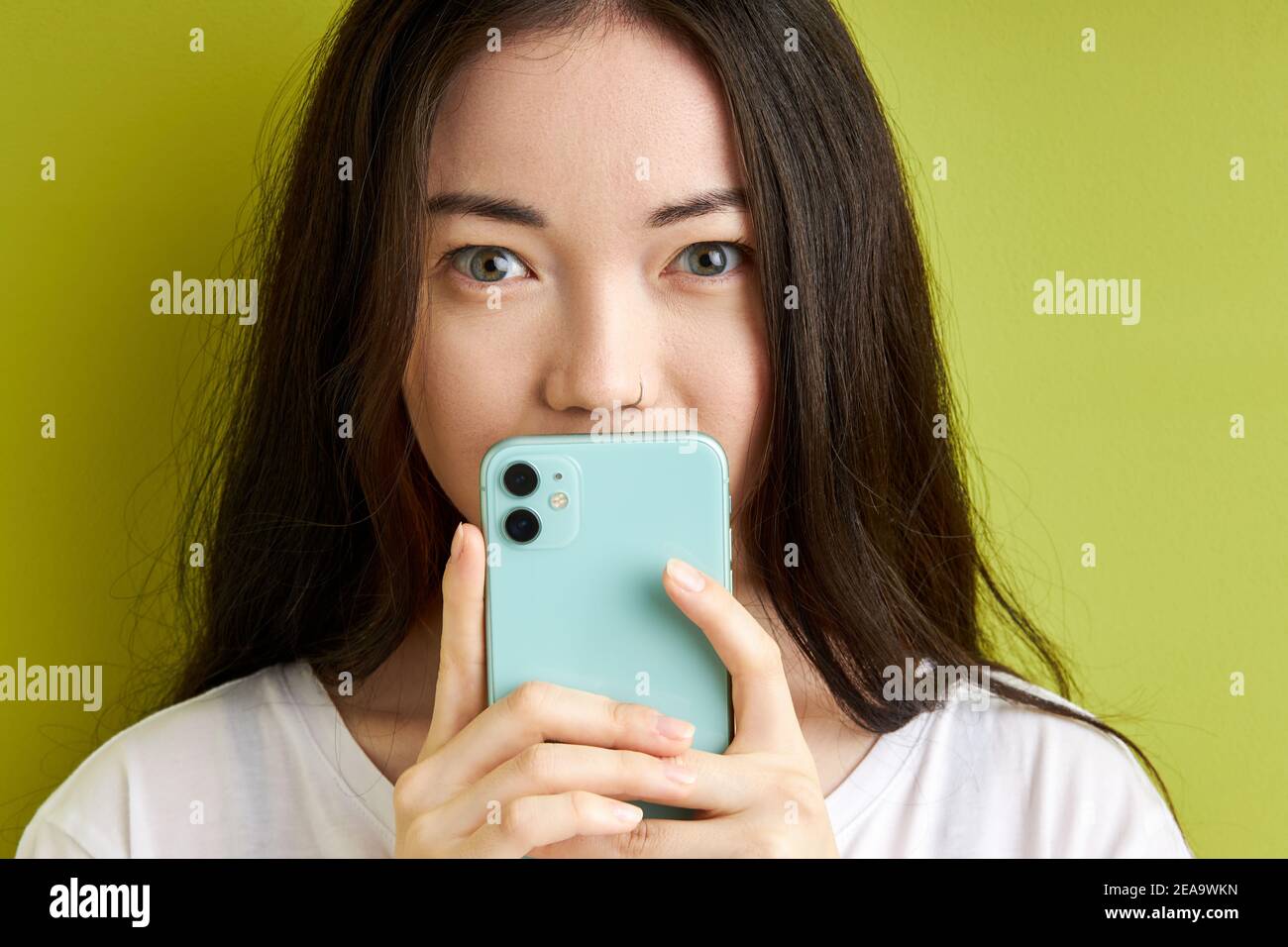 young woman hiding secret information, message in the smartphone ...