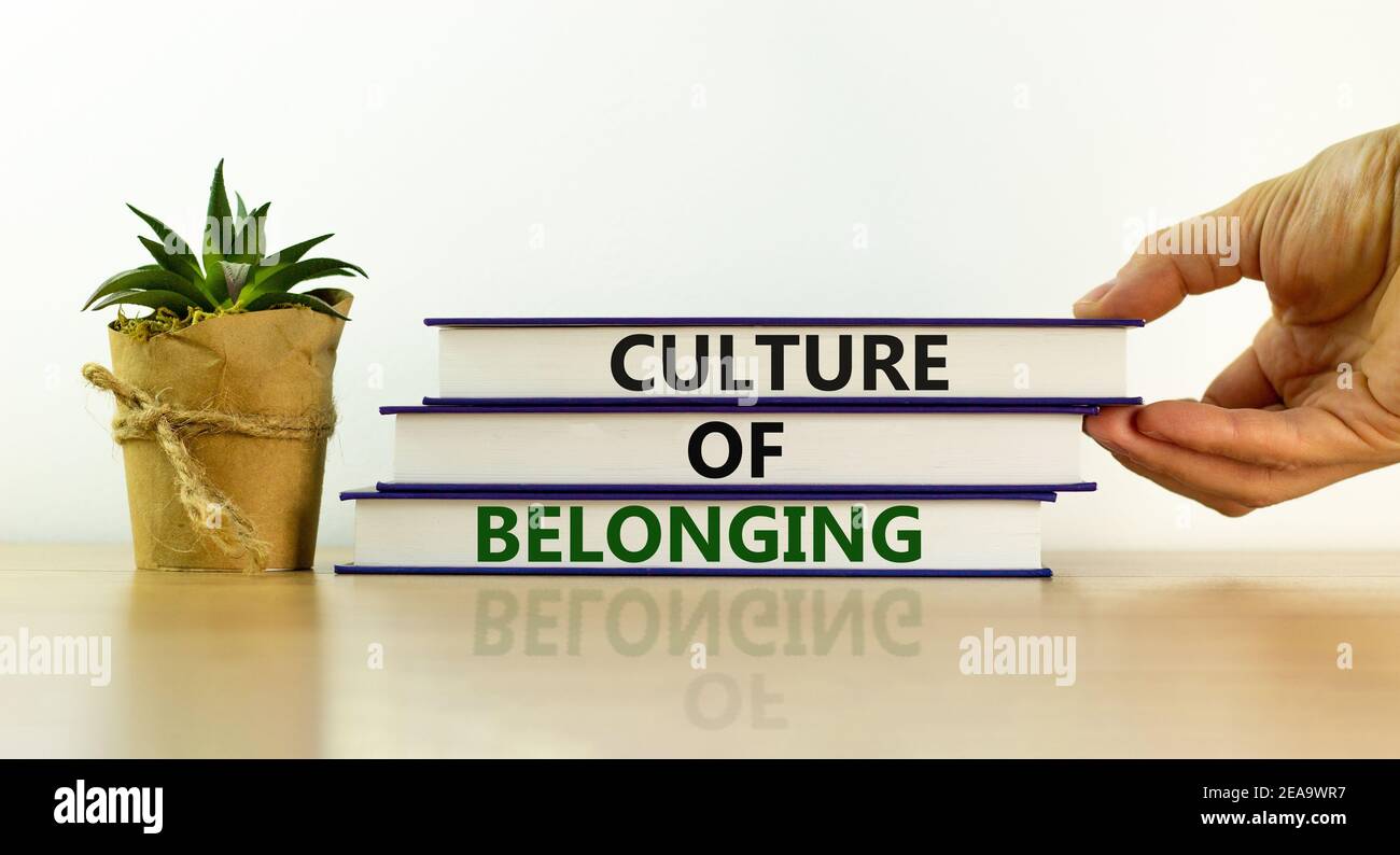 Culture of belonging symbol. Books with words 'culture of belonging' on ...