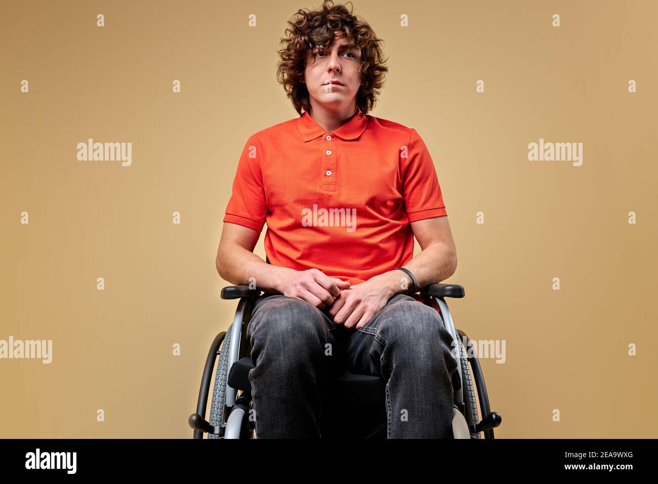 disabled person on wheelchair is looking upset, has no meaning of life ...