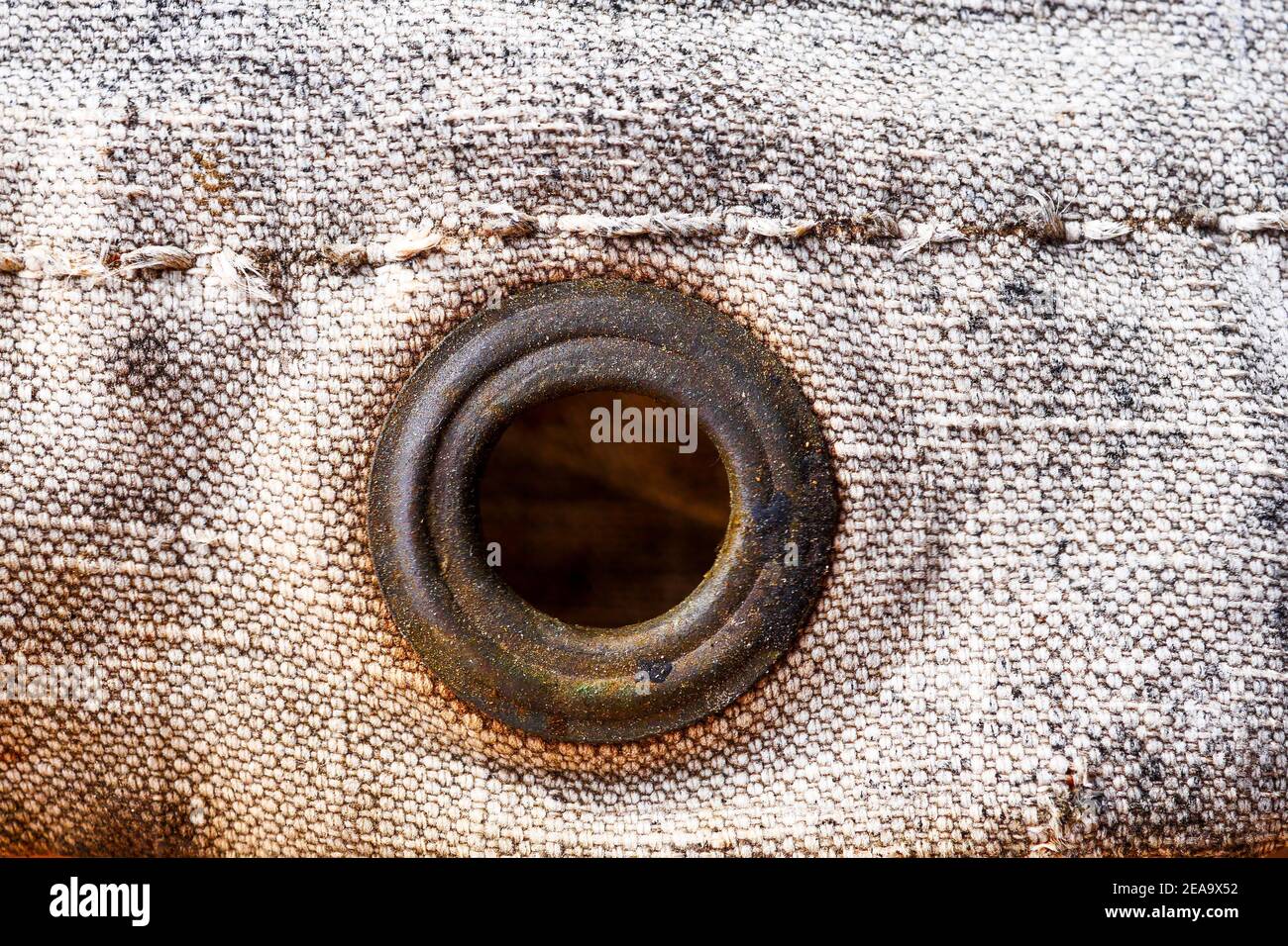 Rusted ring in an old tarpaulin, close-up view, France Stock Photo - Alamy
