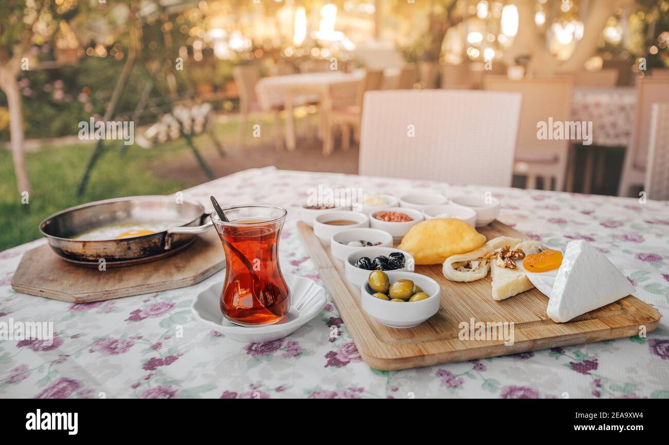 Freshly prepared Turkish Breakfast consisting of scrambled eggs, tea ...
