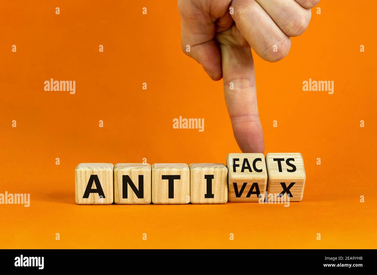 Anti-facts or anti-vax symbol. Doctor turns a cube, changes words 'anti ...