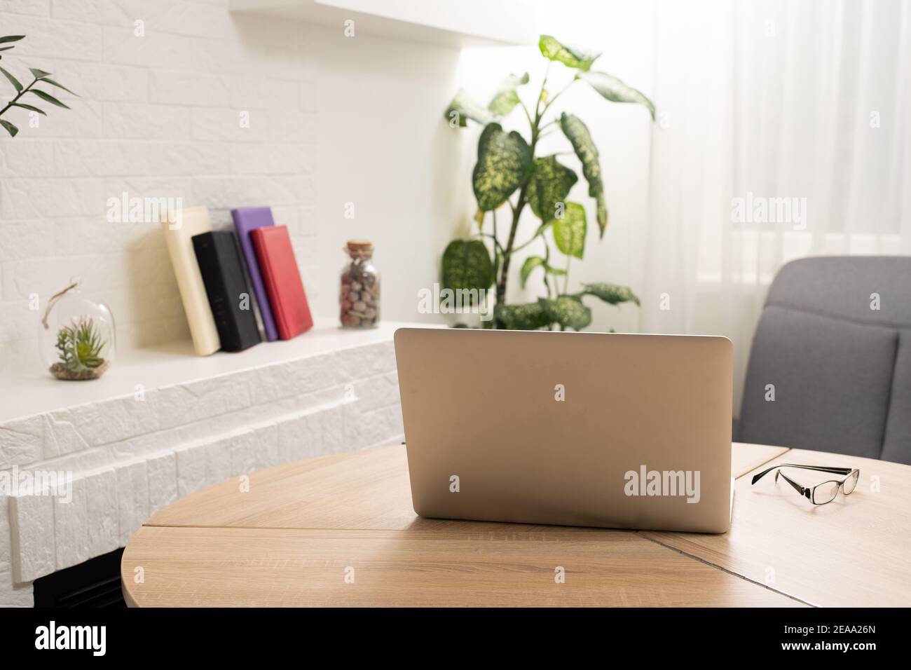 design of workplace with laptop in home office Stock Photo - Alamy