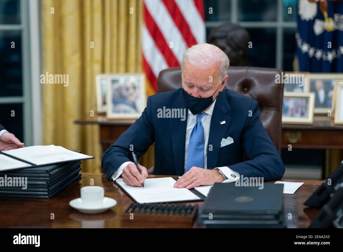 President Joe Biden signs one of the 17 Executive Orders he signed on ...