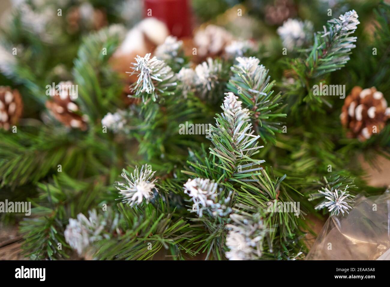 Happy new year background with artificial spruce branches and cones ...