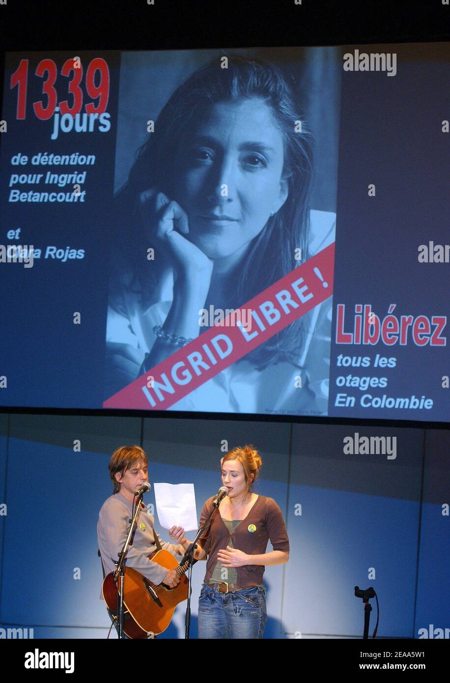 French singer Jean-Louis Aubert and actress Julie Depardieu perform ...