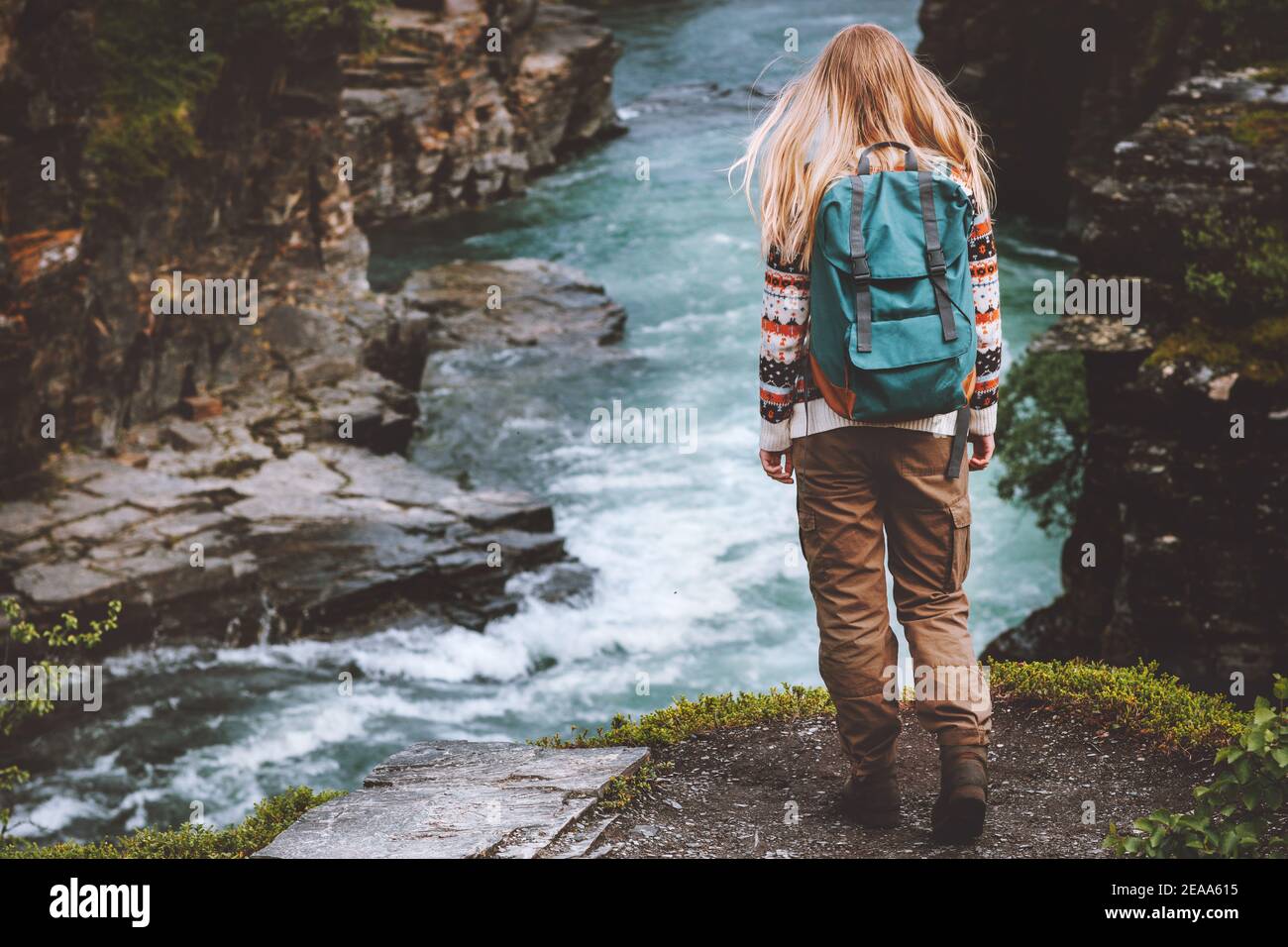 Woman with backpack solo traveling in Sweden outdoor vacation active ...