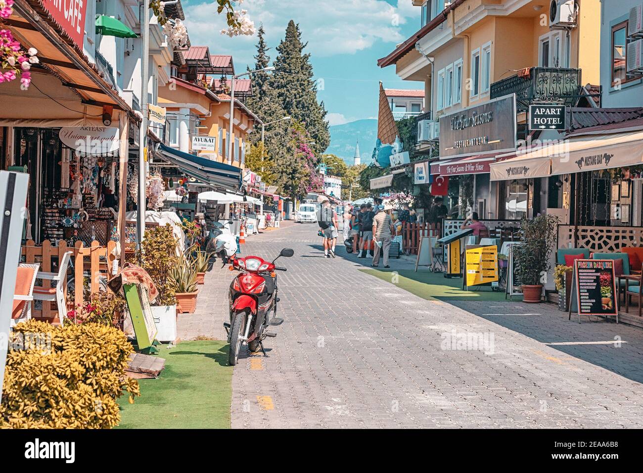 09 September 2020, Dalyan, Turkey: Quite City street with motorcycle ...