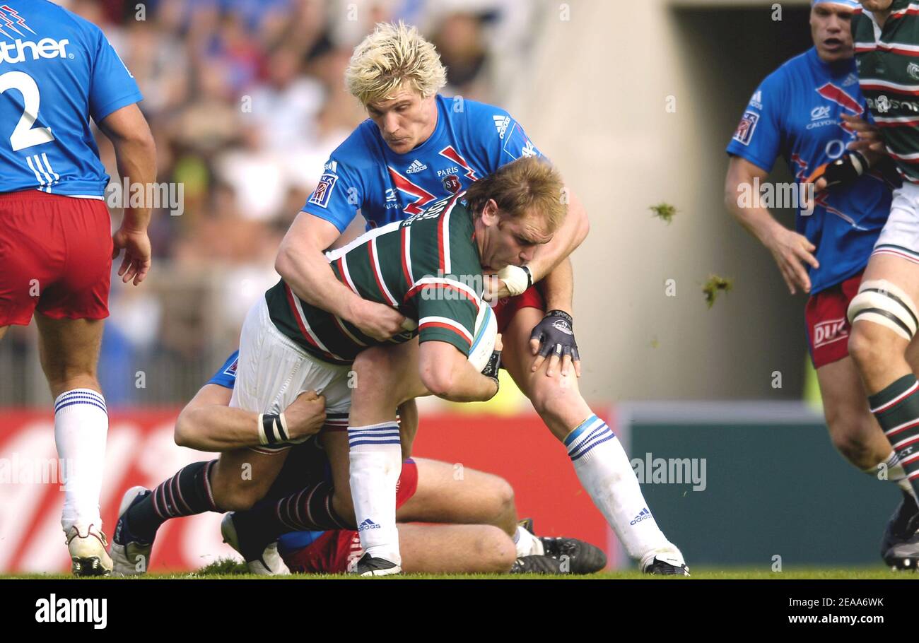 Andy Goode of Leicester is tackled by Remy Martin of Syade Francais ...