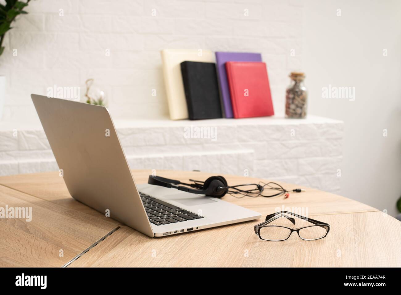 design of workplace with laptop in home office Stock Photo - Alamy