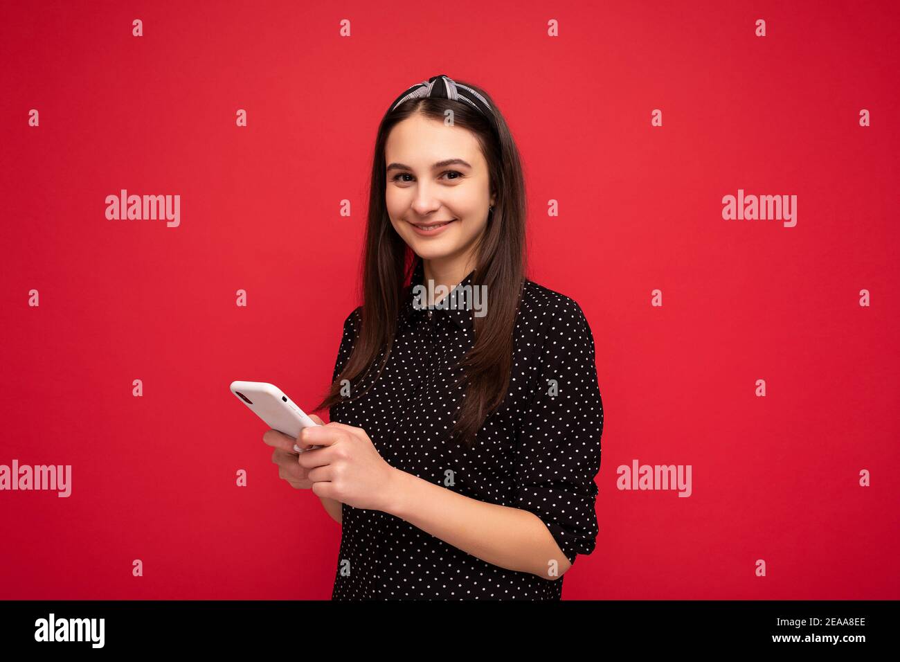 Photo shot of attractive positive good looking young lady wearing ...