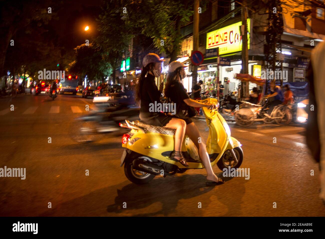 at night, street in Hanoi. yellow moped, Vietnam Stock Photo - Alamy