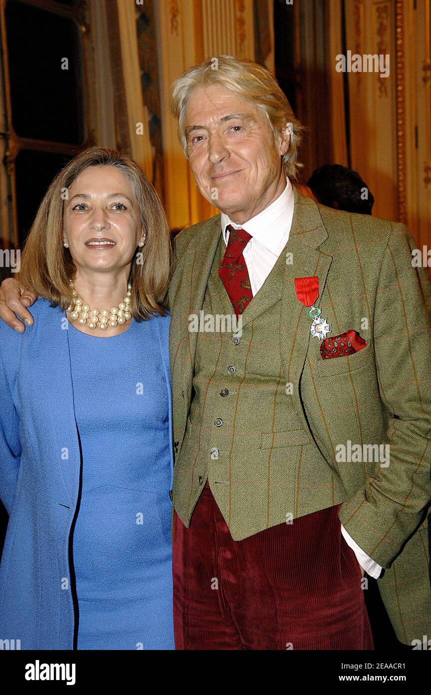 French auctioneer Pierre Cornette de Saint-Cyr poses with his wife ...
