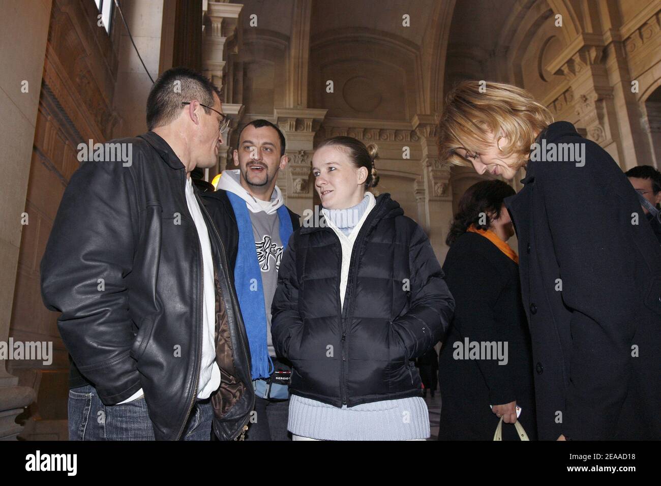 Franck and Sandrine Lavier with Karine Duchochois at the court in Paris ...