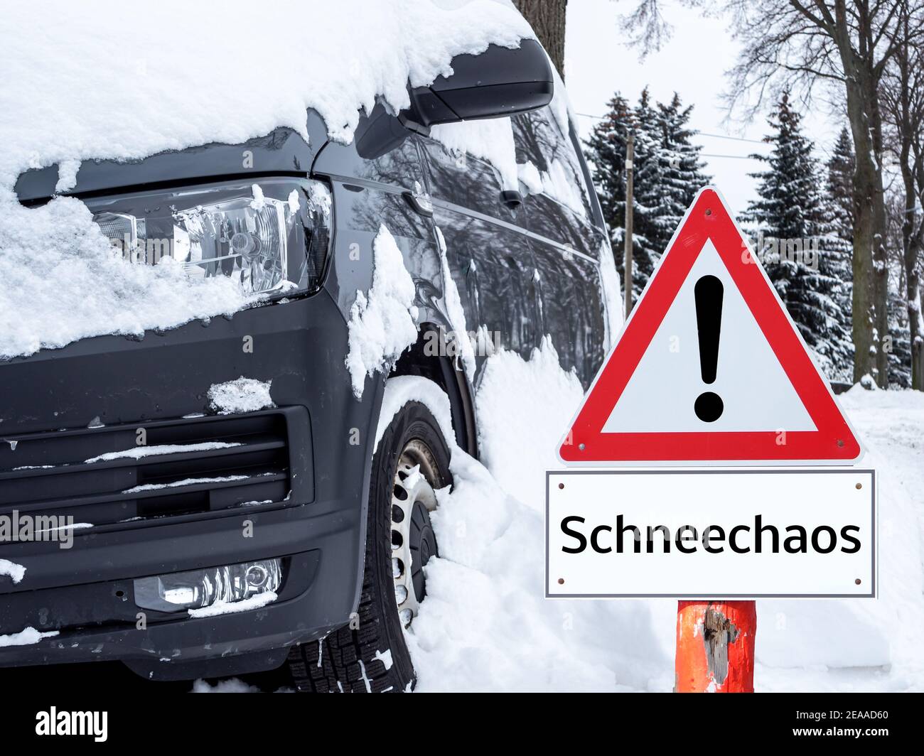 Warning sign "Snow Chaos" Car stuck in the snow in german Stock Photo ...