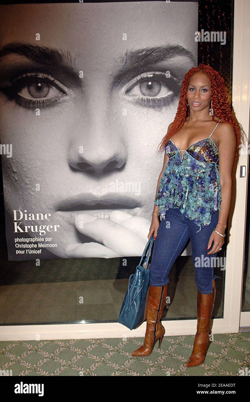 Mia Frye at the launch party of UNICEF calendar 2006, with picture of ...