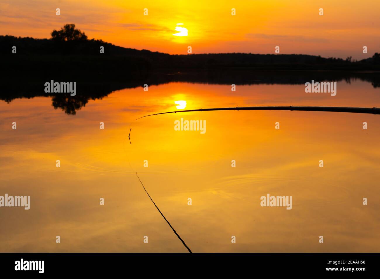 Natural landscape. Sunset over water, reflection of the sun and clouds ...