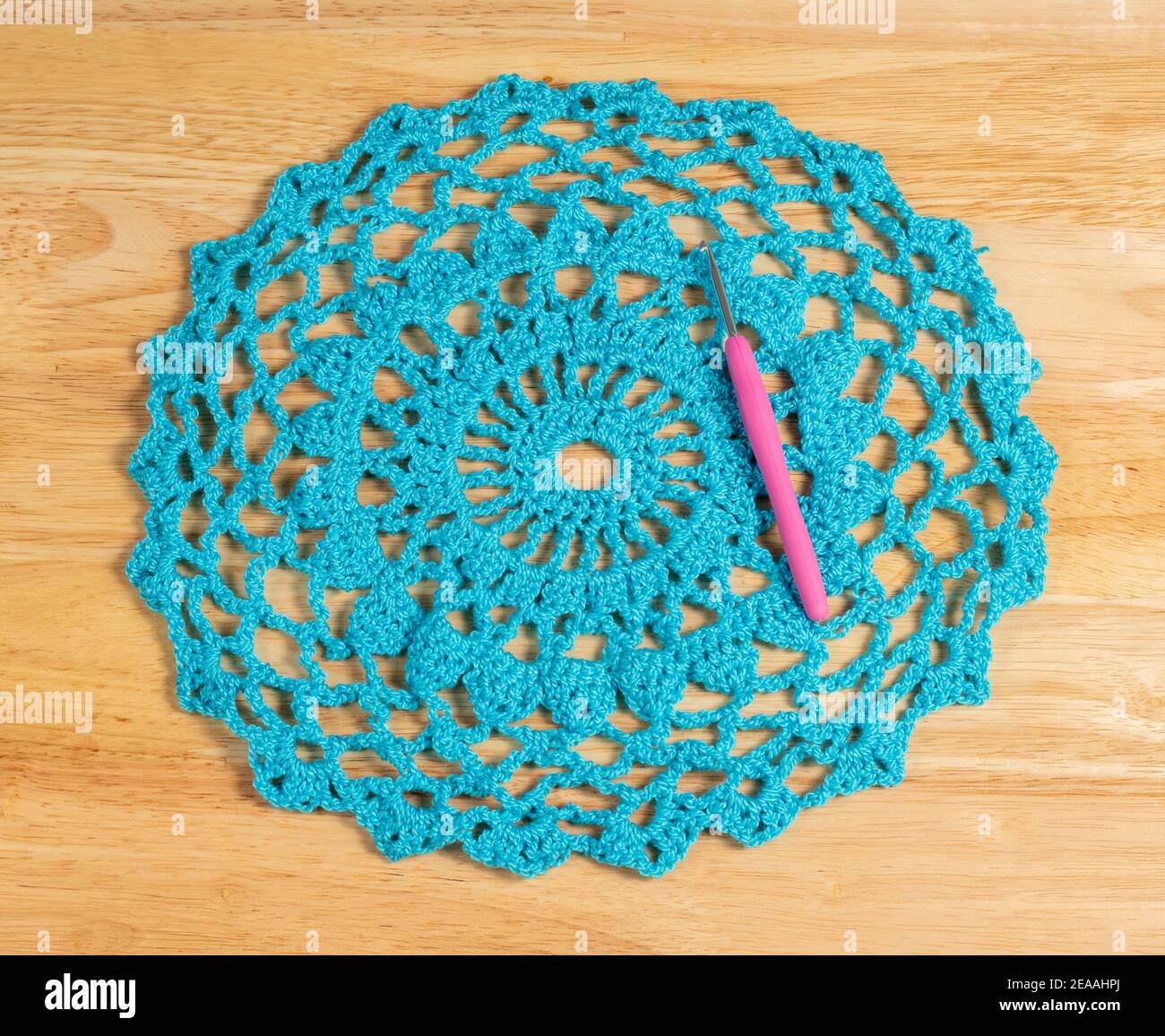 Crochet piece made of wool and knitted by hand cyan Stock Photo - Alamy