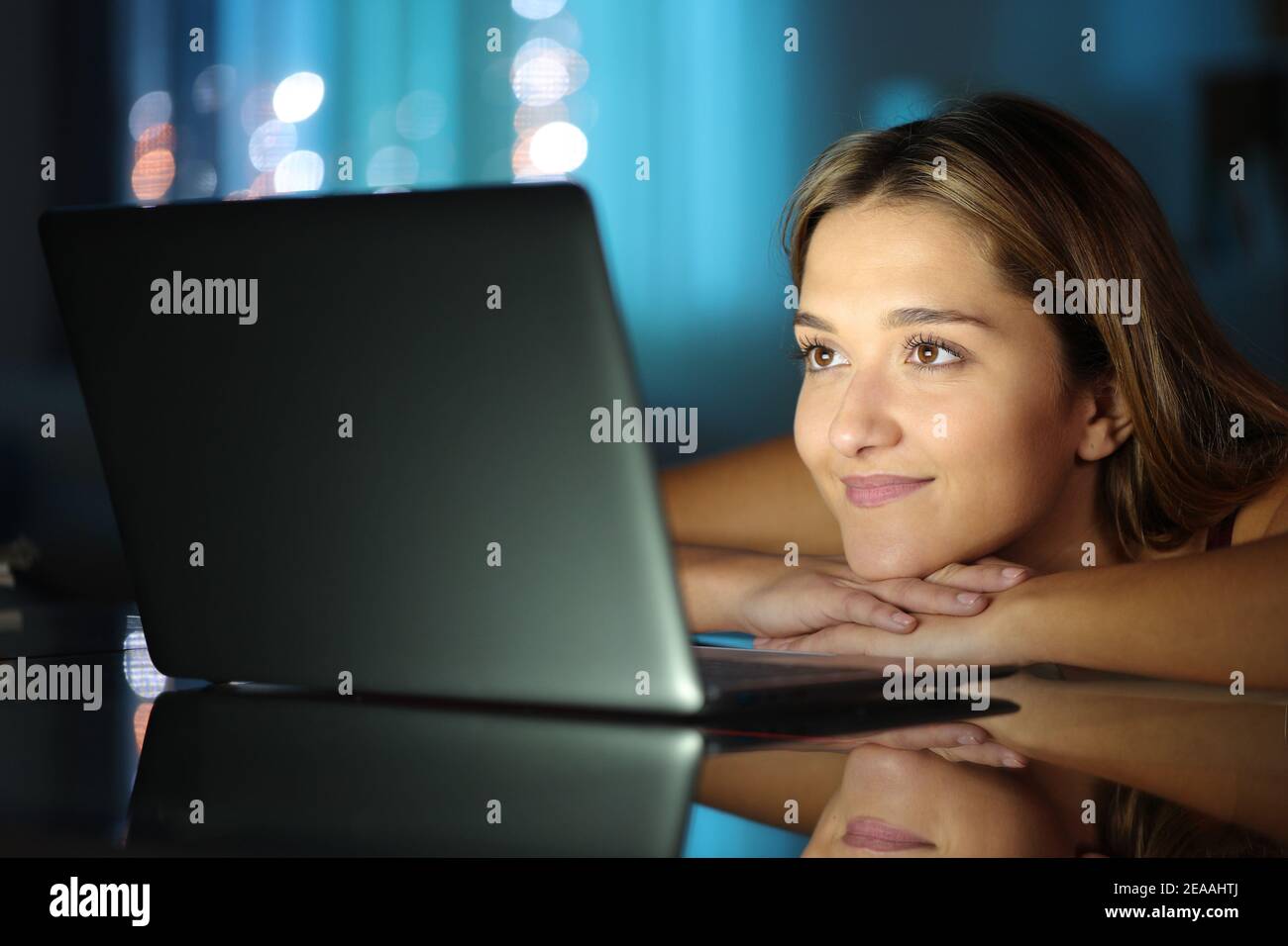 Teenager on laptop dark hi-res stock photography and images - Alamy