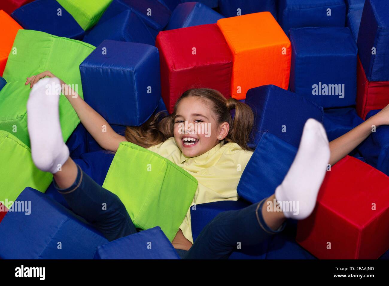 Happy children playing cubes hi-res stock photography and images - Alamy