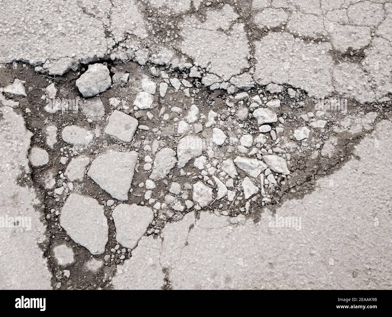 Large pothole with stones on the asphalt highway Stock Photo - Alamy